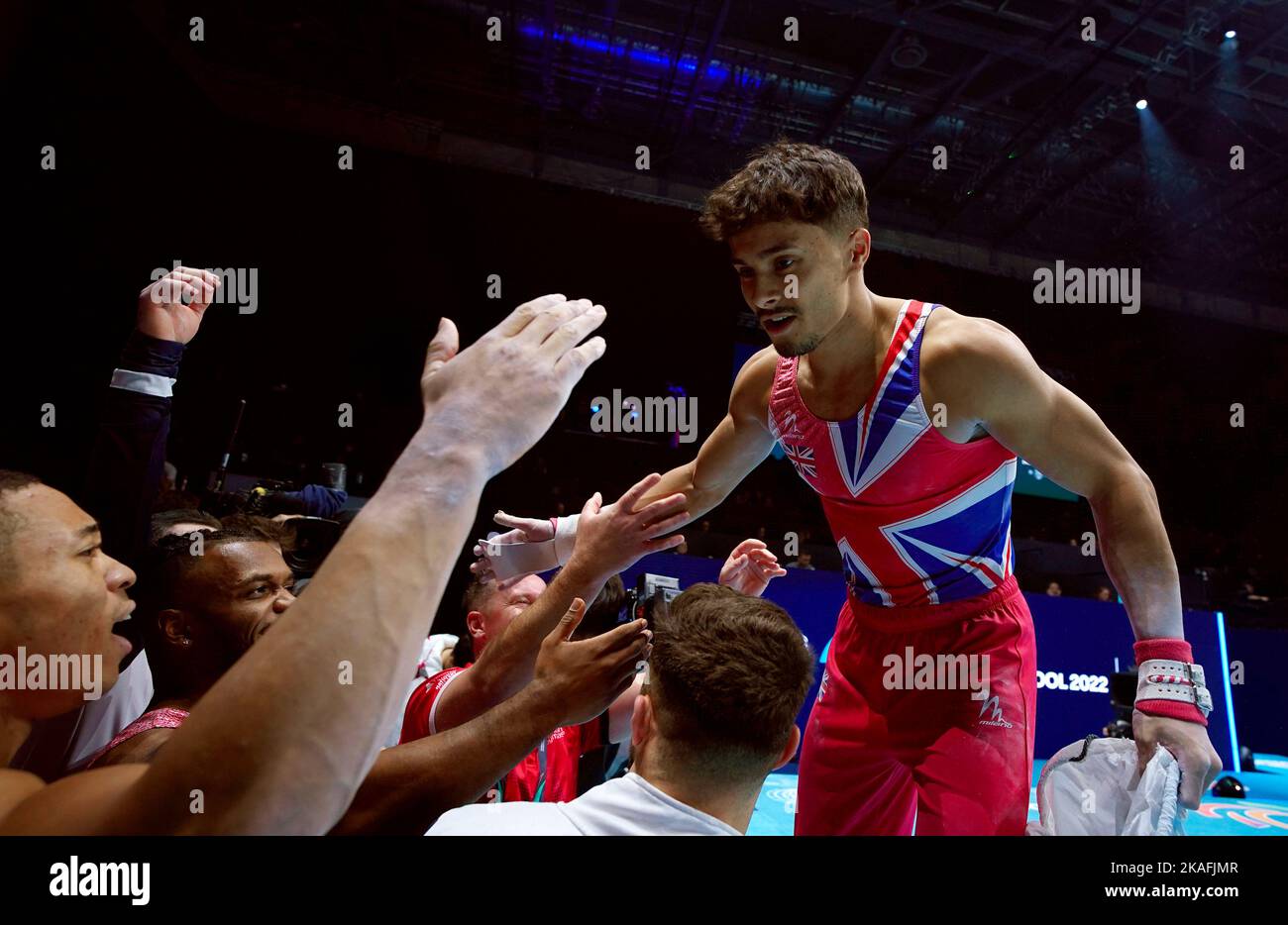 Great Britain's Jake Jarman celebrates winning the team bronze medal ...