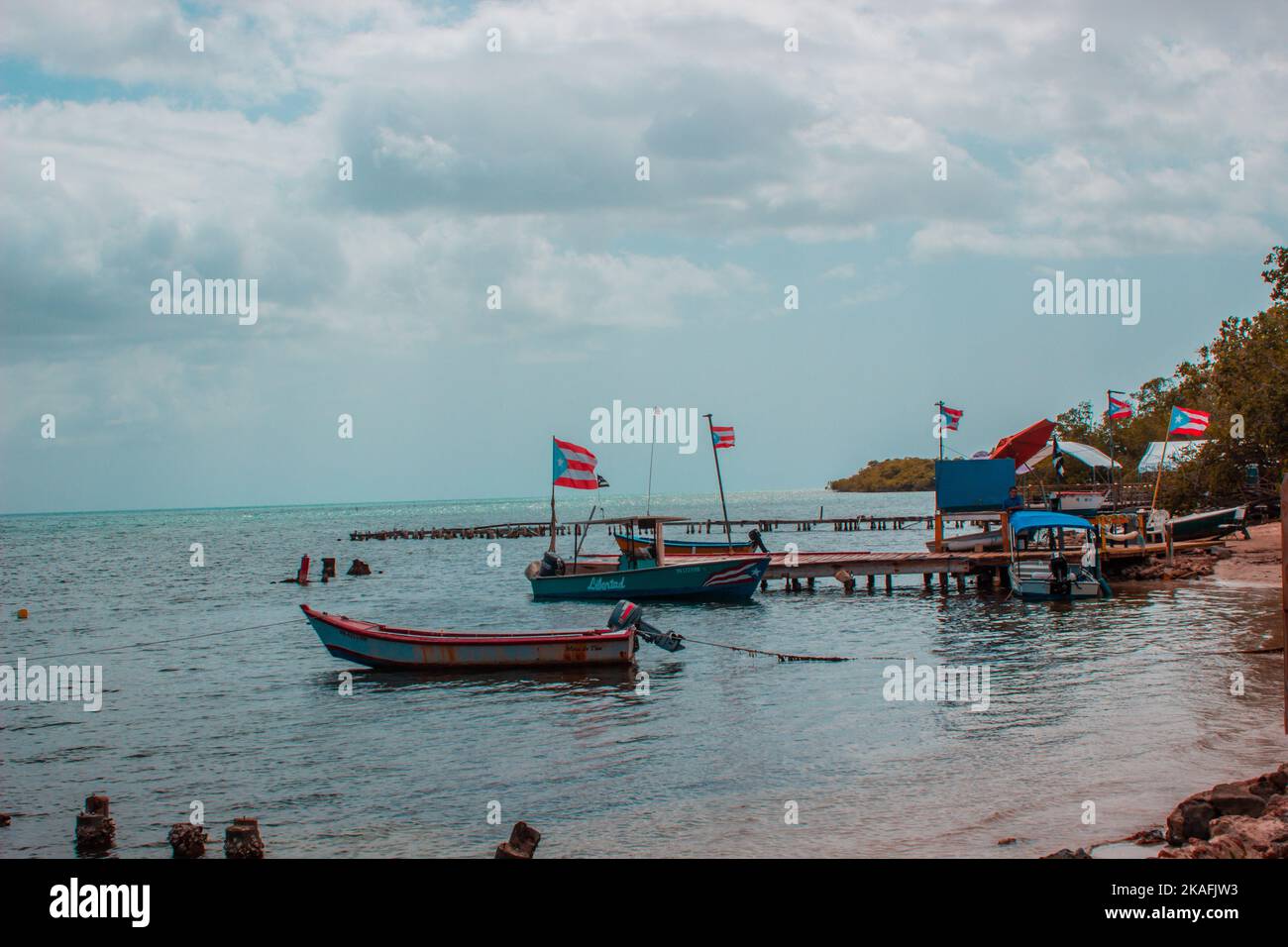 A beautiful shot of boats moored at the beach of Boqueron, Puerto Rico ...