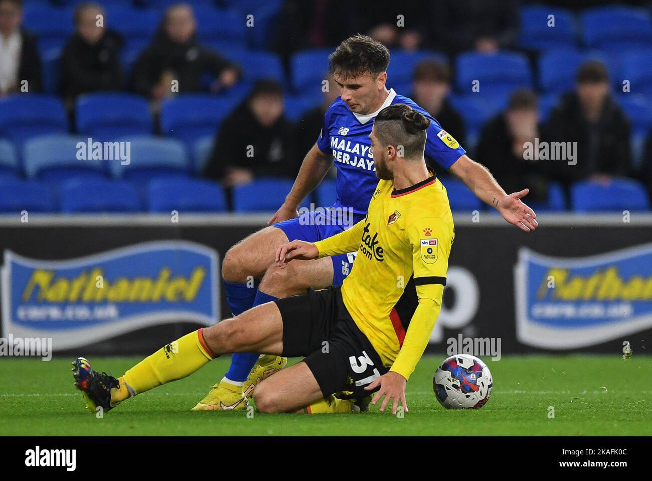Francisco Sierralta #31 of Watford tackles Mark Harris #29 of Cardiff ...