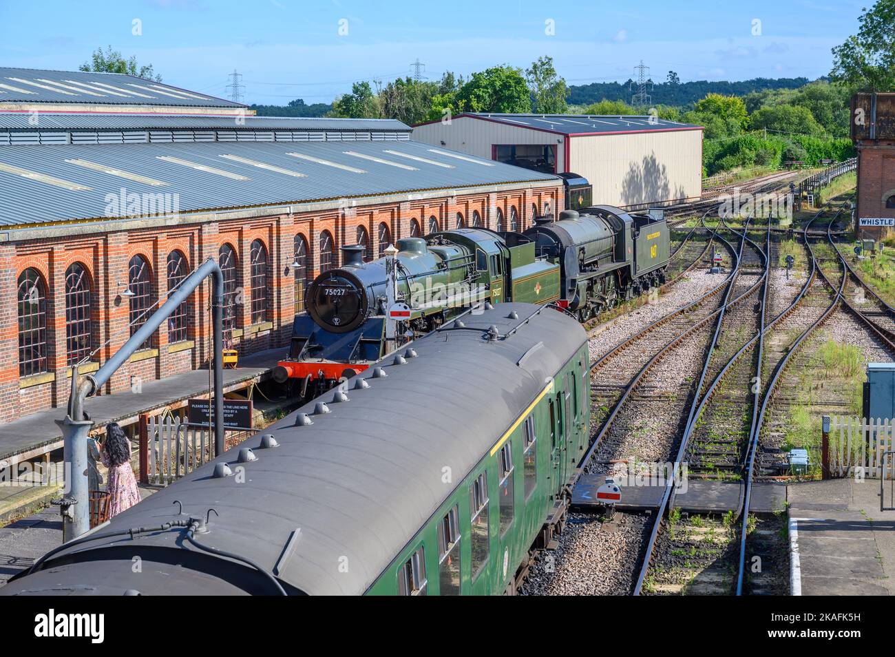 Passenger carriages and old steam locomotives parked at Sheffield Park ...