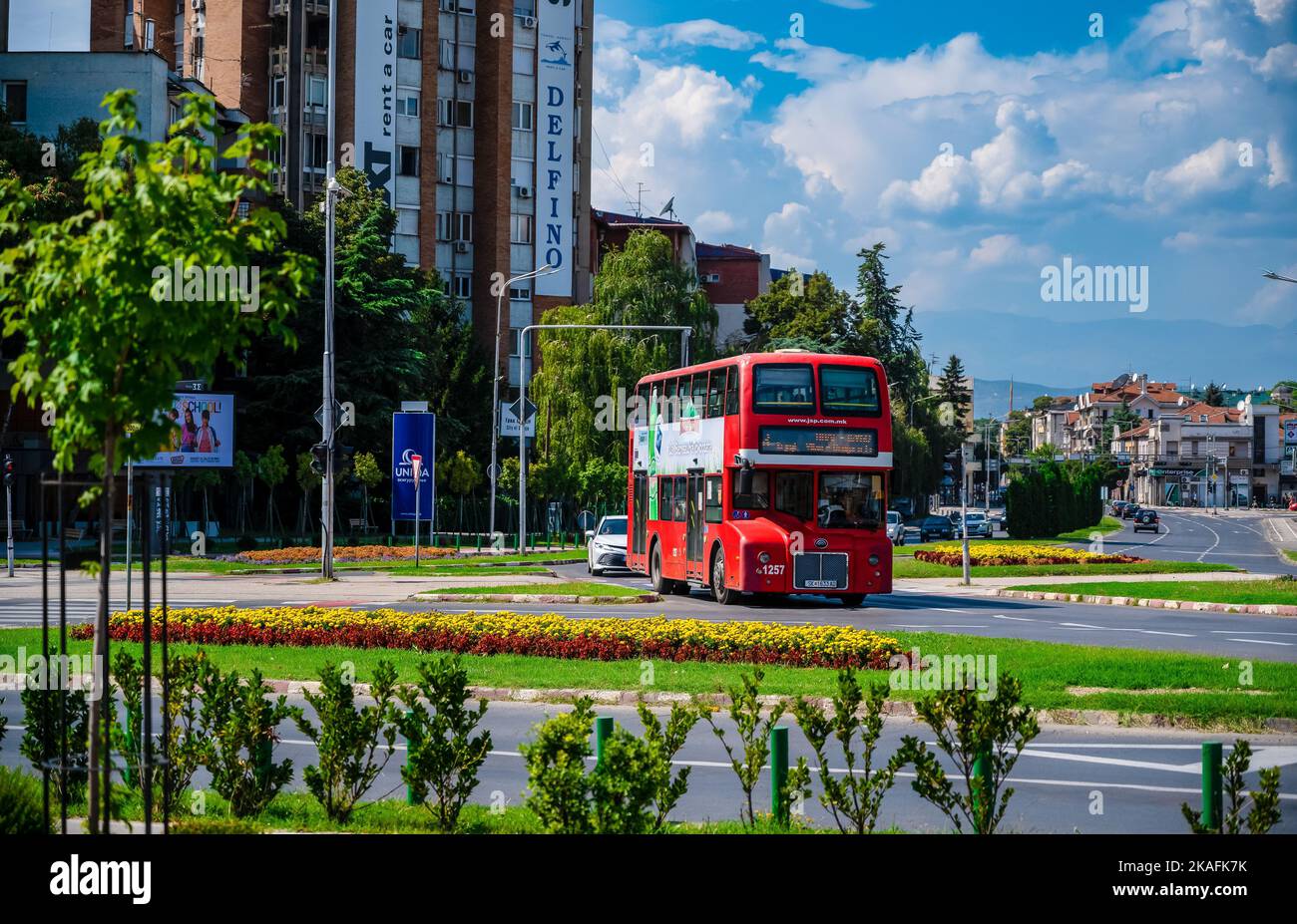 Double-decker red bus on the roundabout in Skopje city, capital of ...