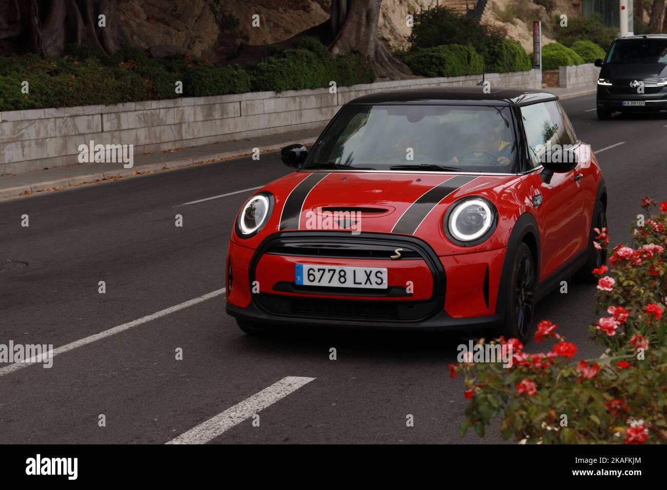 The red Mini Cooper crossing the road, close-up Stock Photo - Alamy