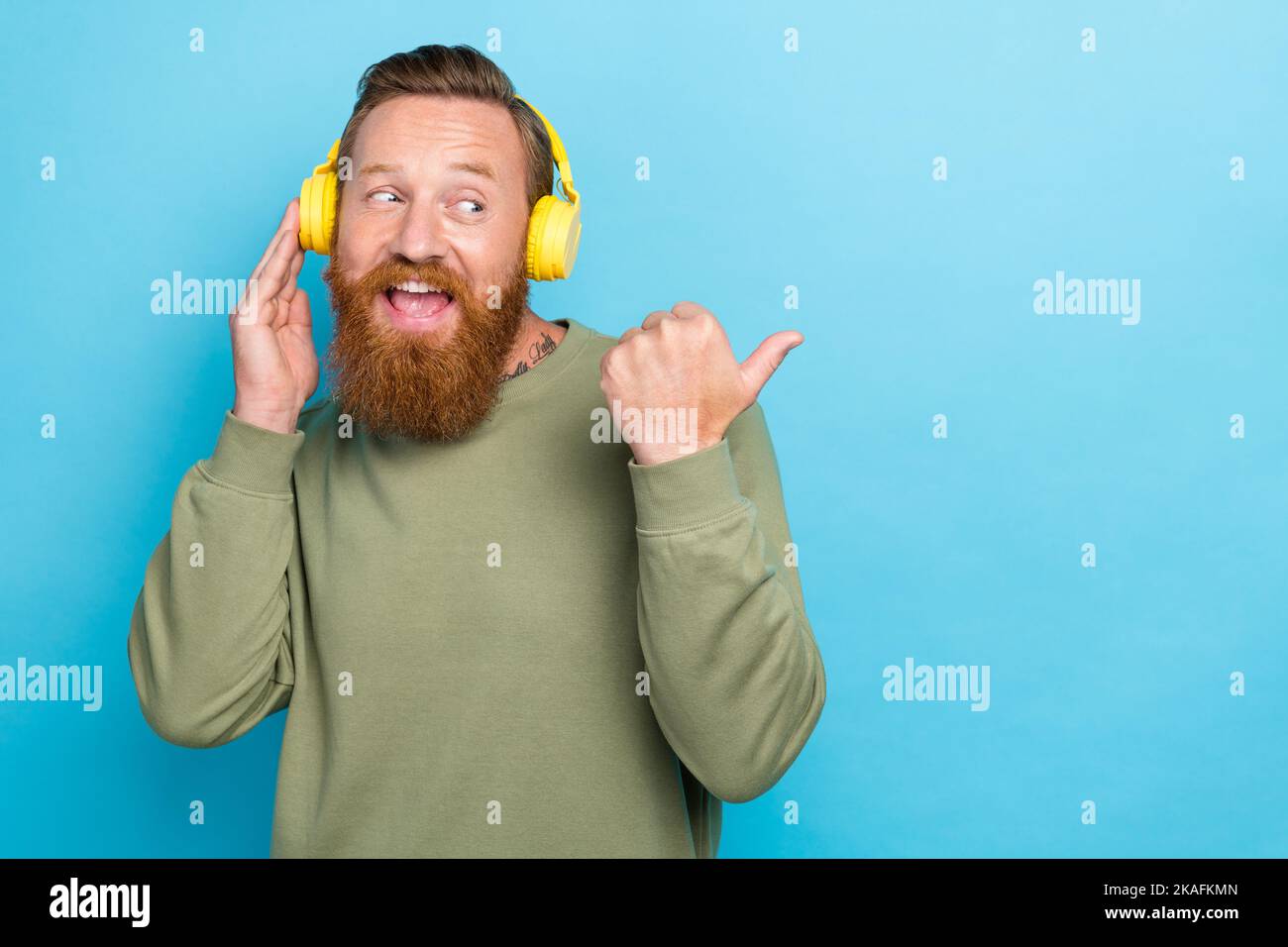 Photo of positive stylish man arm direct demonstrate empty space ...