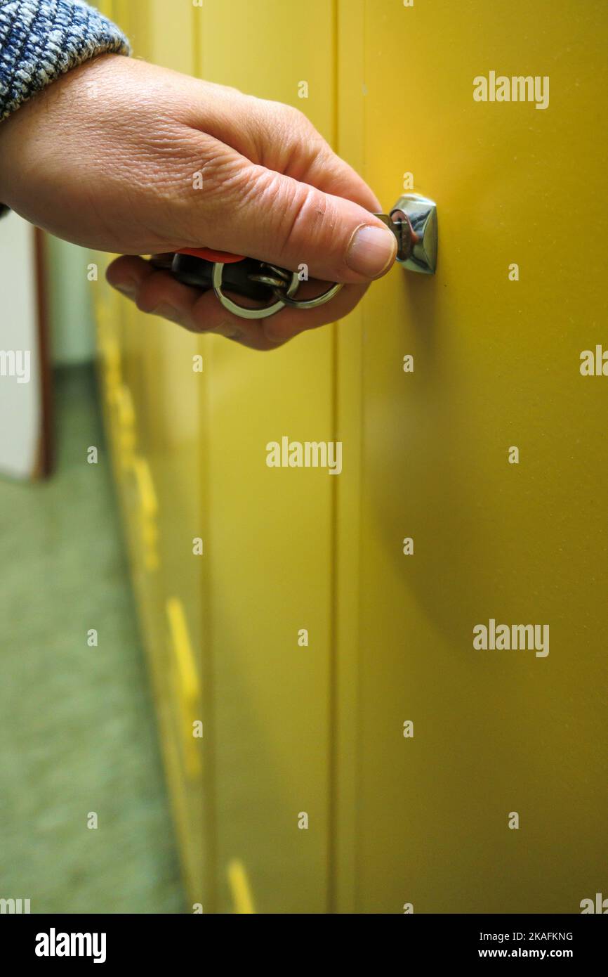 a locker is unlocked with a key Stock Photo - Alamy