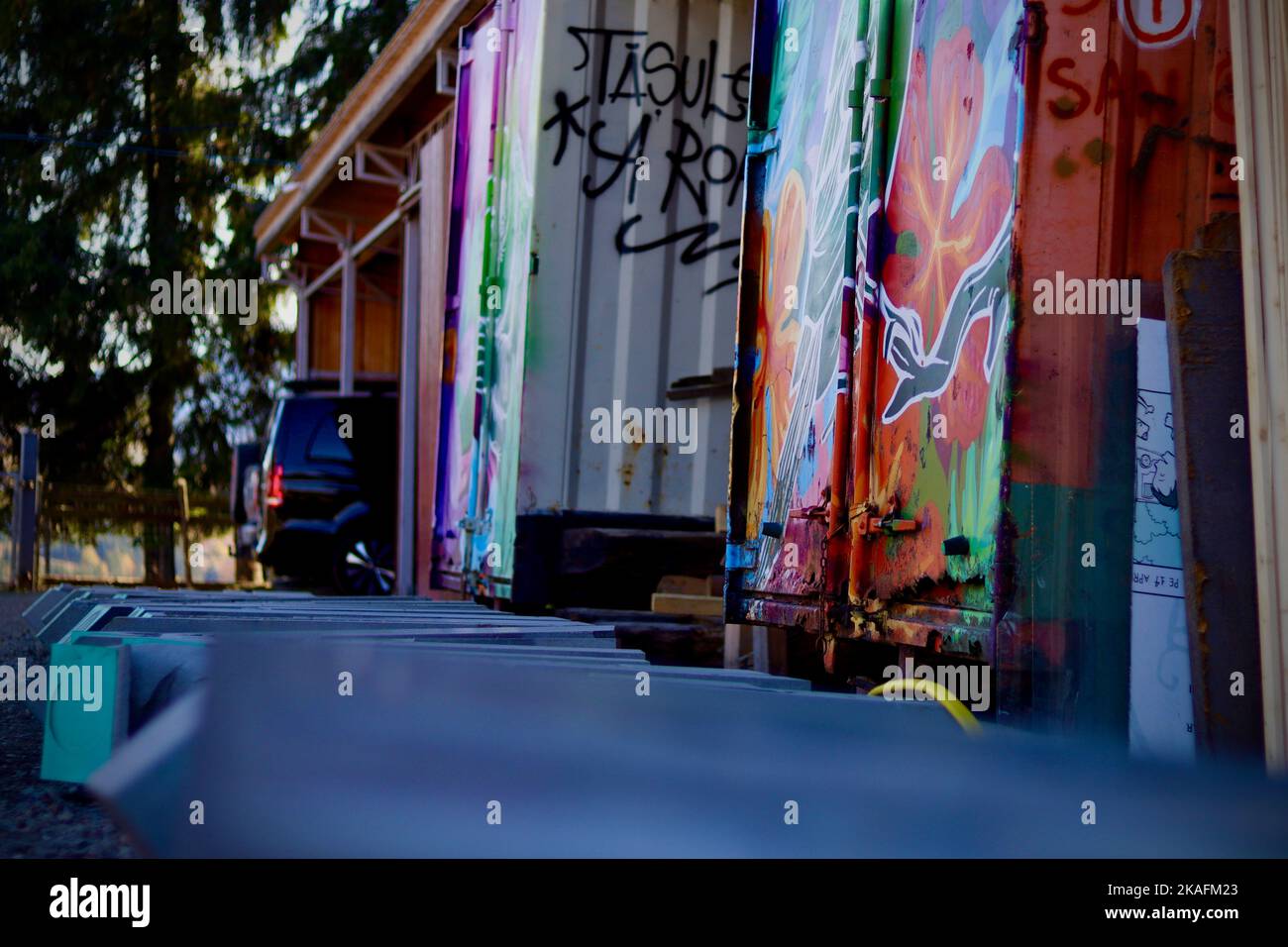 The colorful street art on the garage walls Stock Photo - Alamy