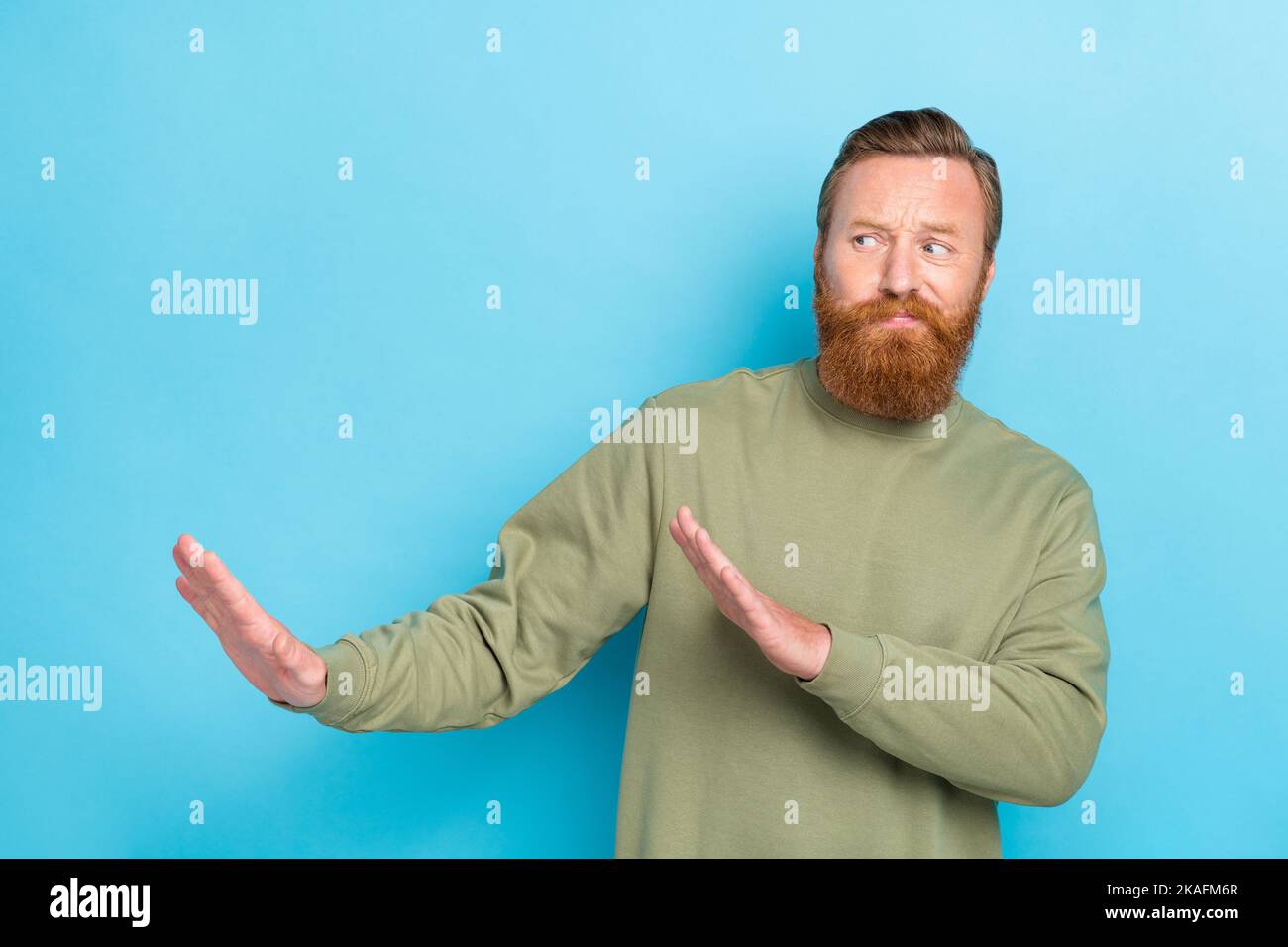 Photo of upset unhappy guy with ginger hairdo dressed khaki long sleeve ...