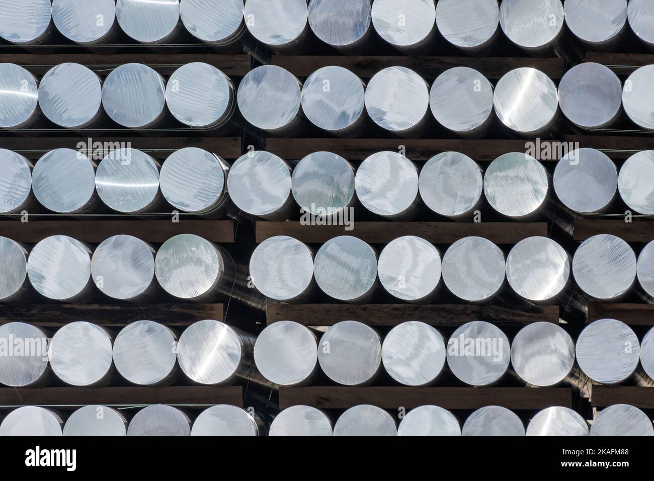 aluminium round bars in outdoor storage Stock Photo - Alamy
