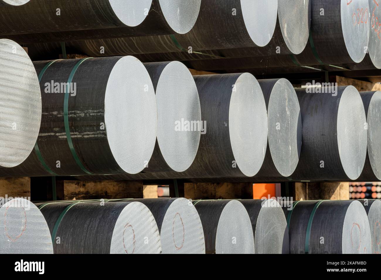 aluminium round bars in outdoor storage Stock Photo - Alamy