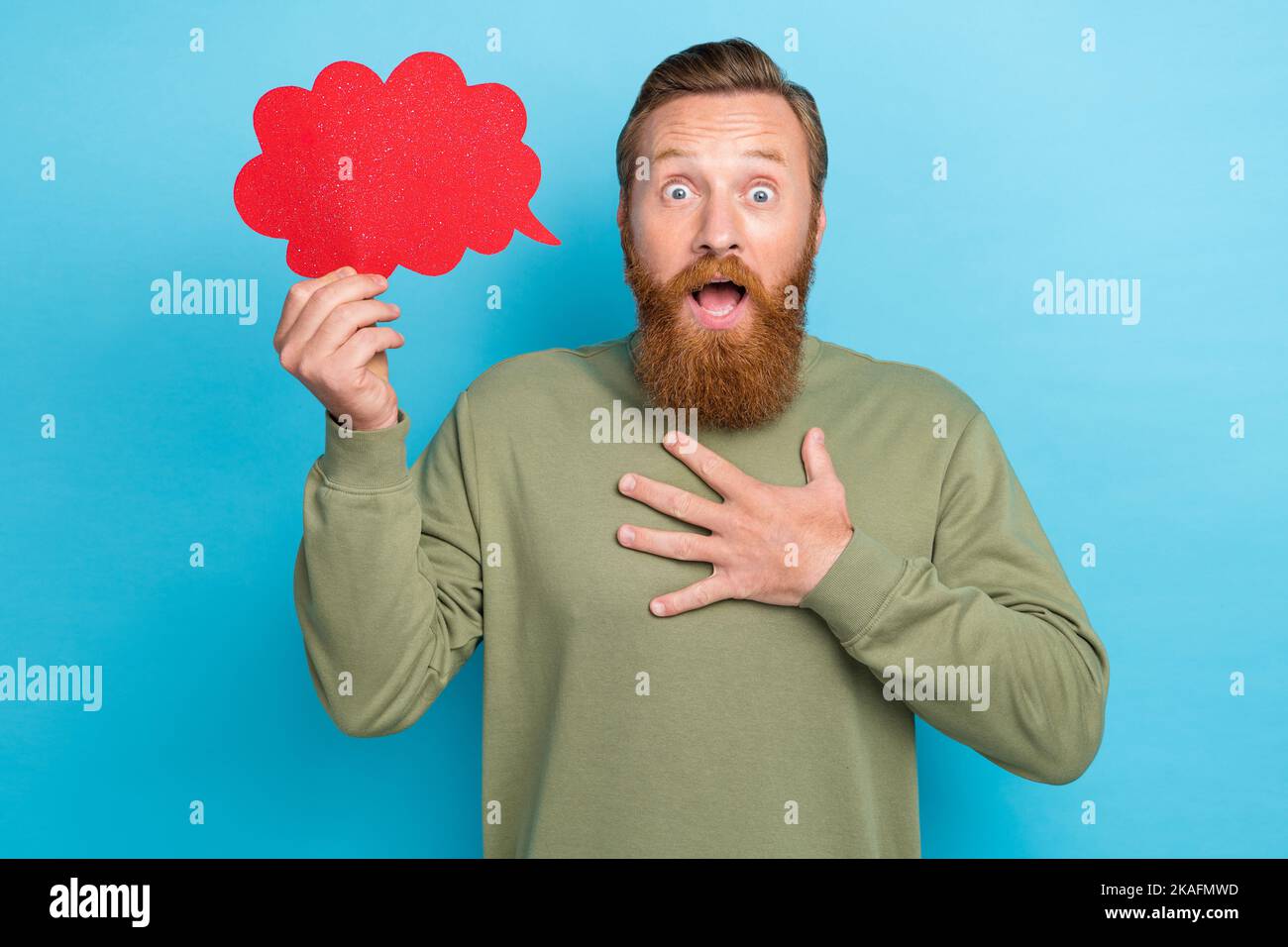 Photo portrait of handsome young man hold dialog paper cloud impressed ...