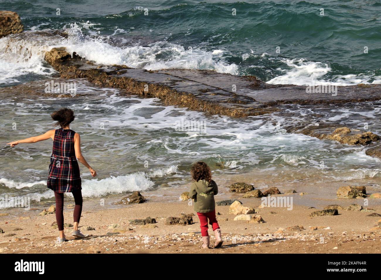 A woman and her daughter at the Tel Shikmona beach, Haifa, Israel Stock ...