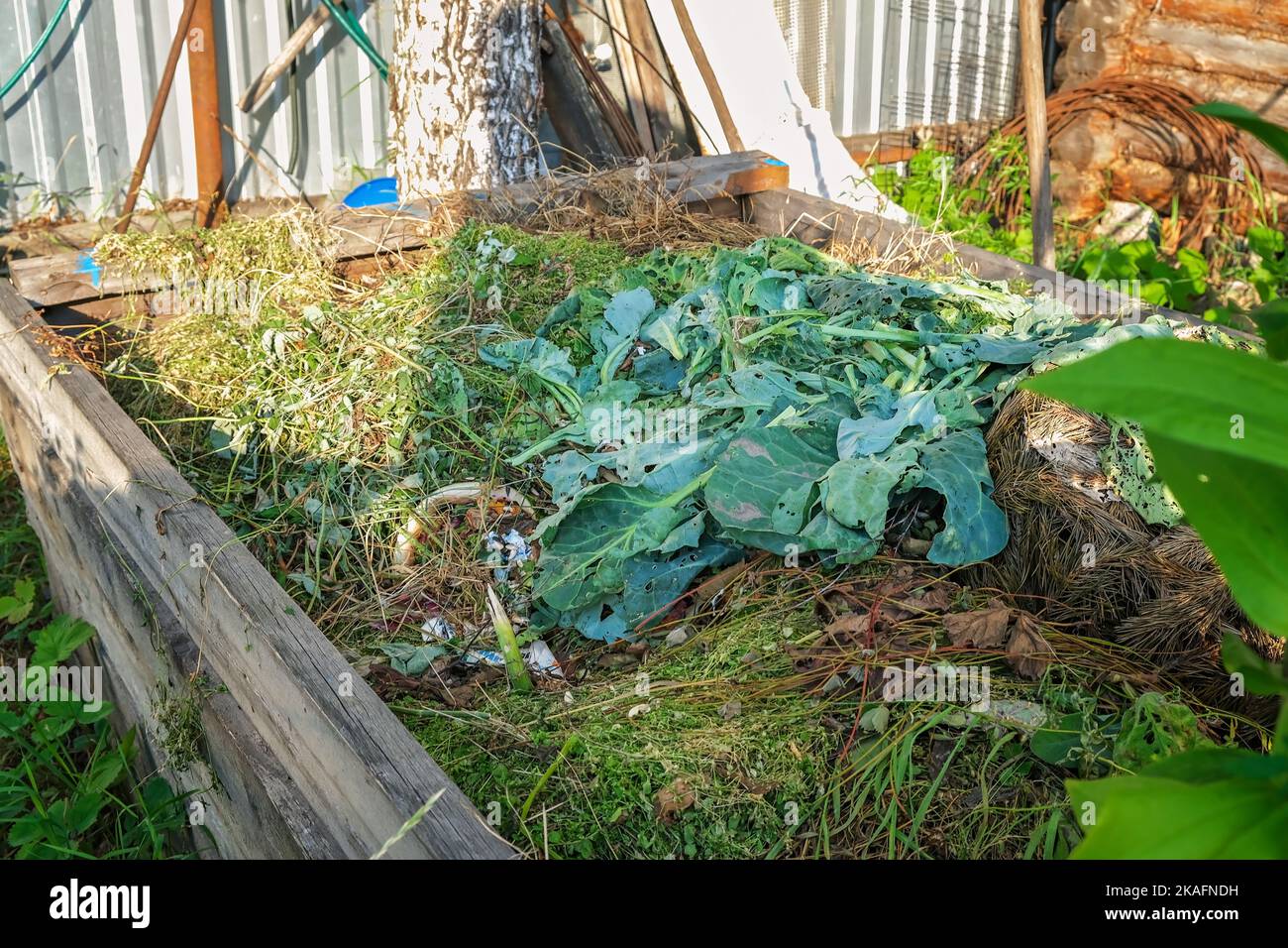 A compost heap in the village. Compost bin in the village. A compost ...