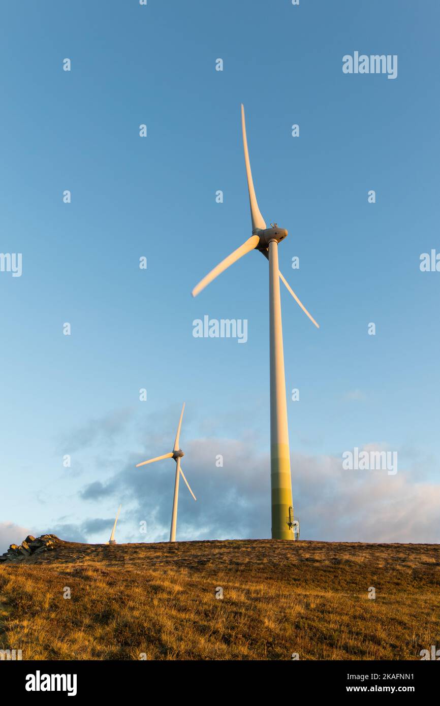 A wind mill power plant on a mountain ridge with blue sky Stock Photo ...