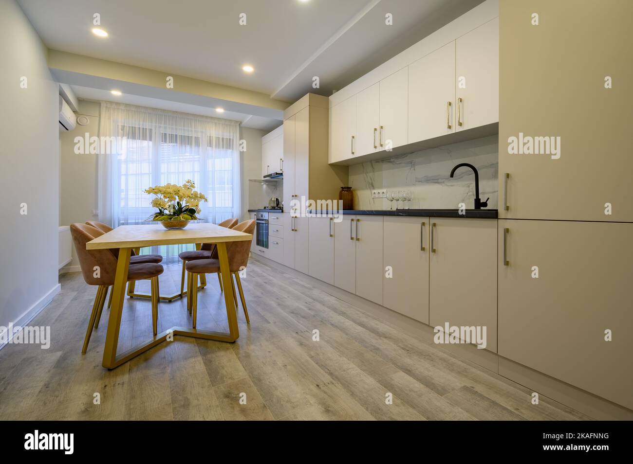 Large beige and cream luxury kitchen interior Stock Photo - Alamy