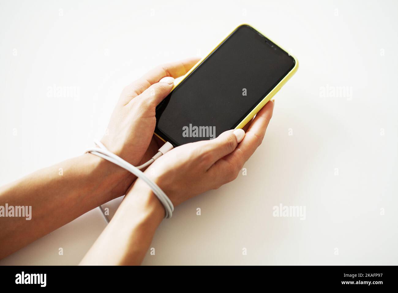 Female hands tied handcuffs hi-res stock photography and images - Alamy