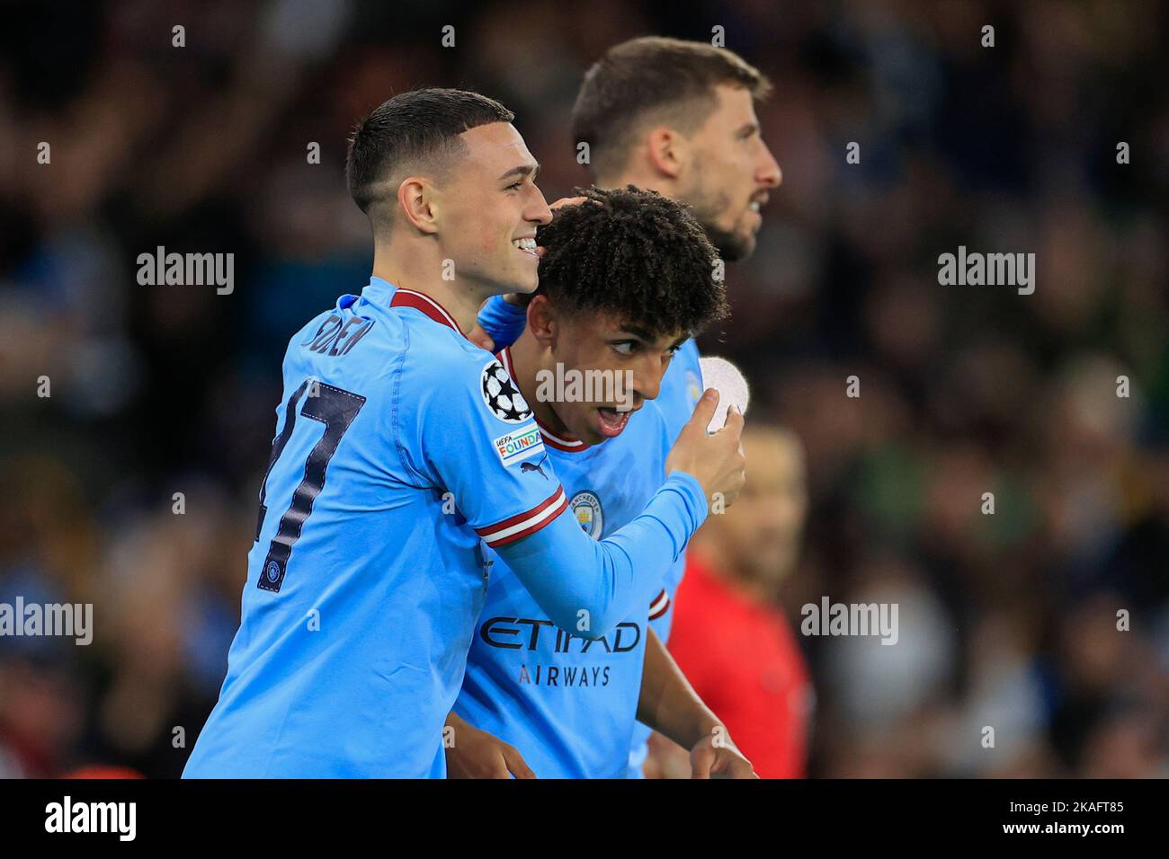 Phil Foden #47 of Manchester City celebrates with Rico Lewis #82 of ...
