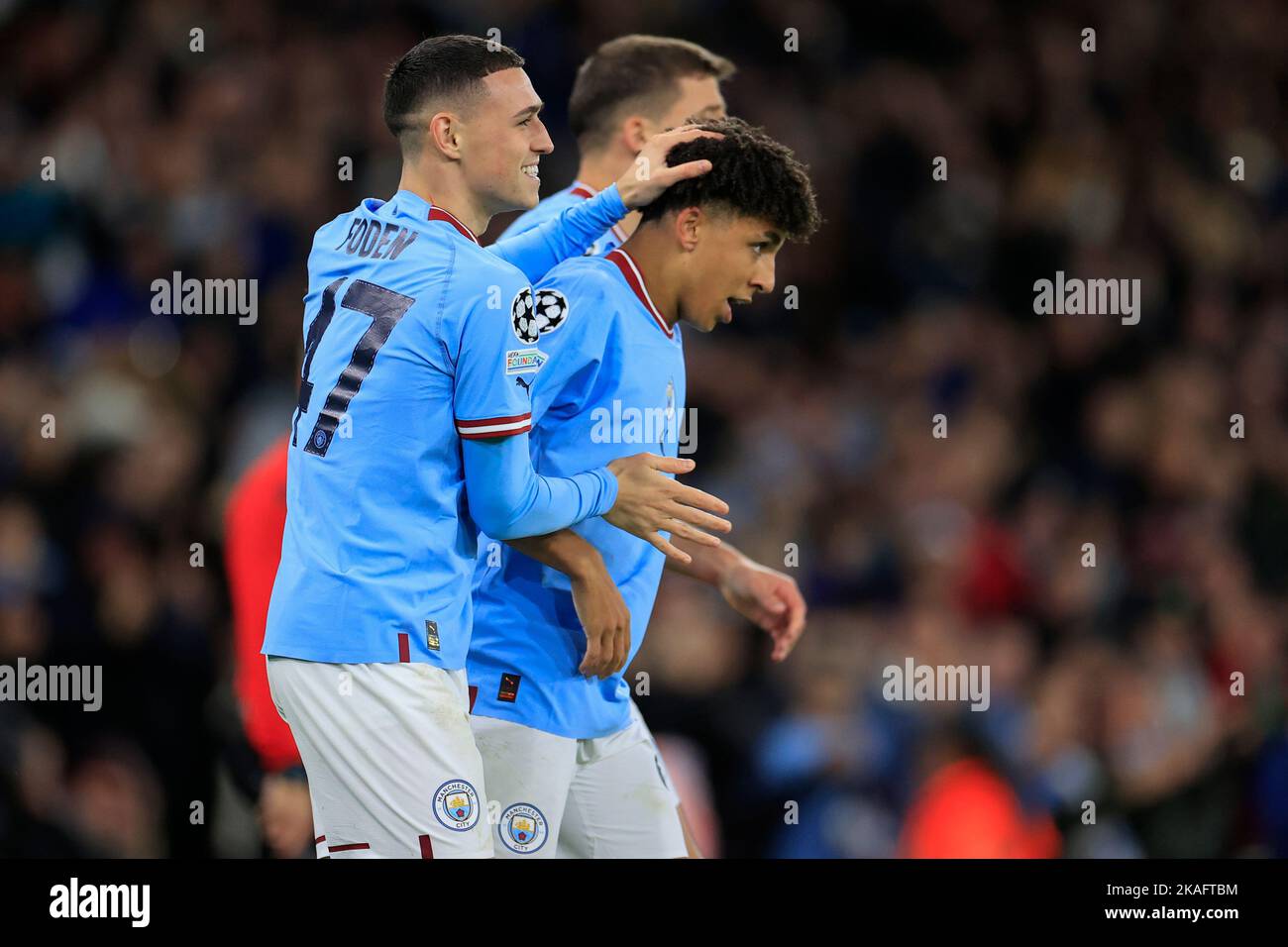 Phil Foden #47 of Manchester City celebrates with Rico Lewis #82 of ...