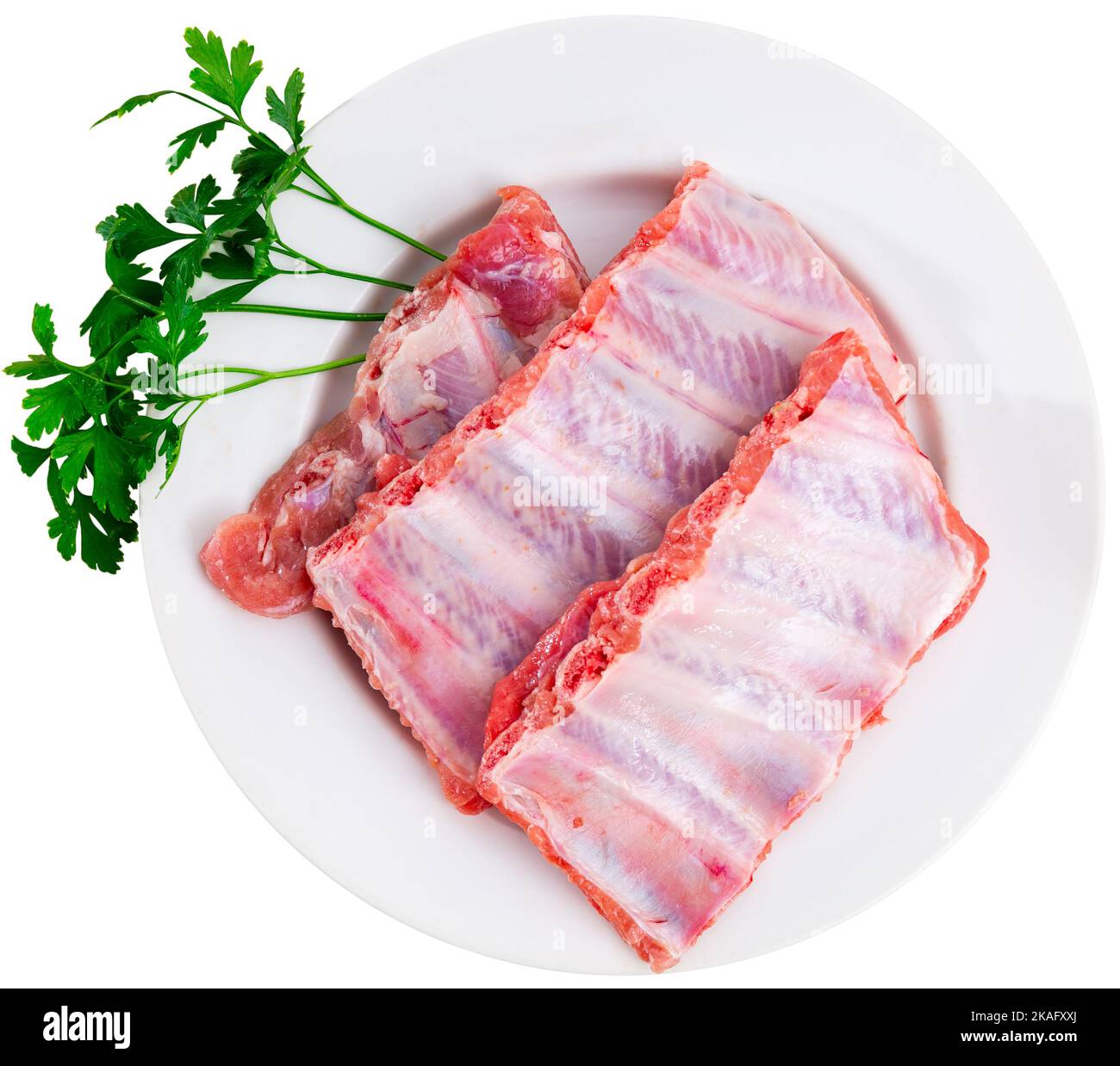Raw pork ribs ready for cooking on white Stock Photo - Alamy