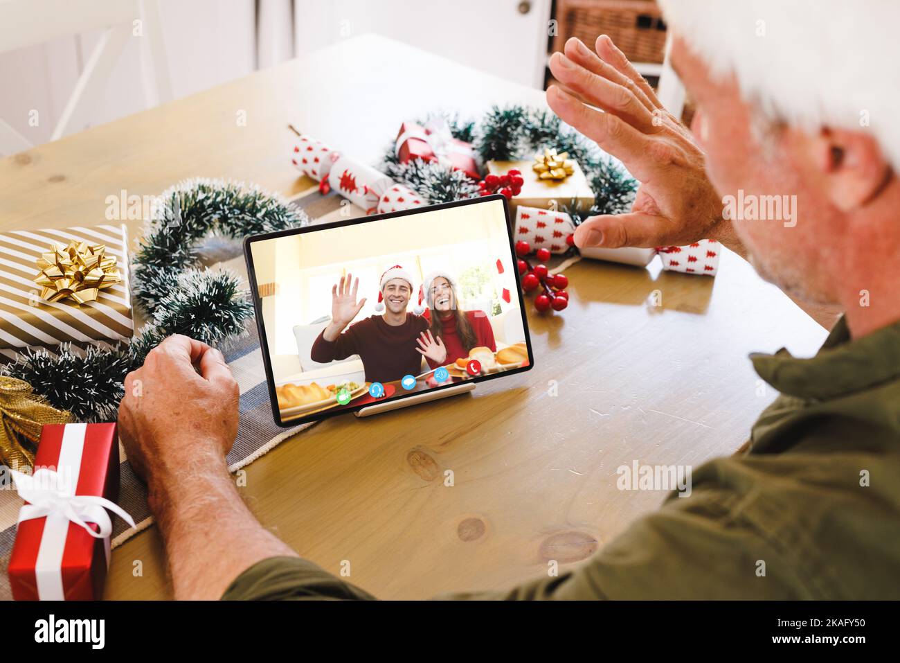 Caucasian man with santa hat having video call with happy caucasian ...