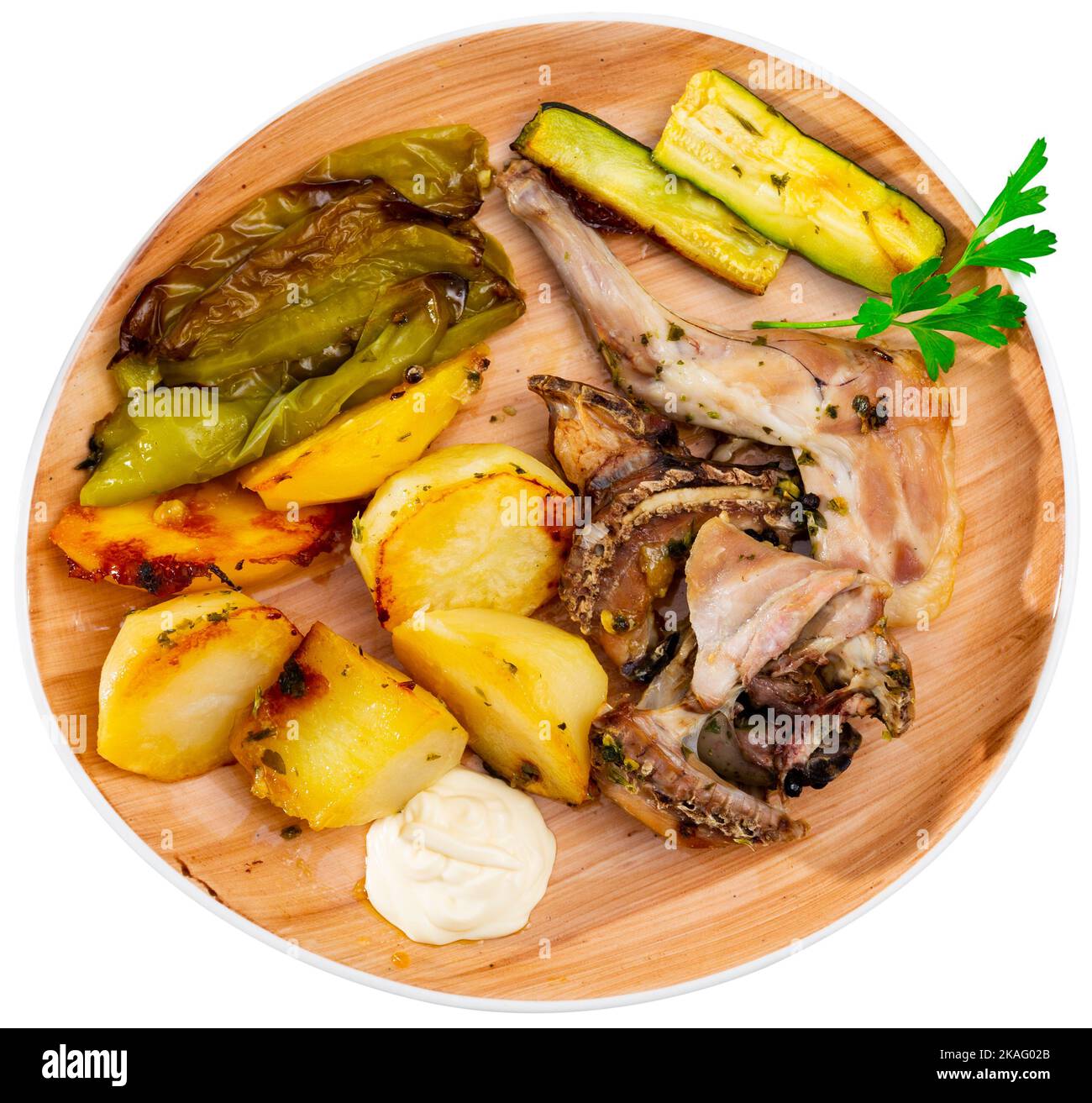 Roasted rabbit served with vegetable garnish Stock Photo - Alamy