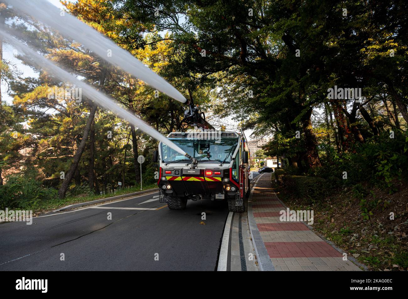 A U.S. Air Force Aircraft Rescue and Fire Fighting (ARFF) truck sprays ...