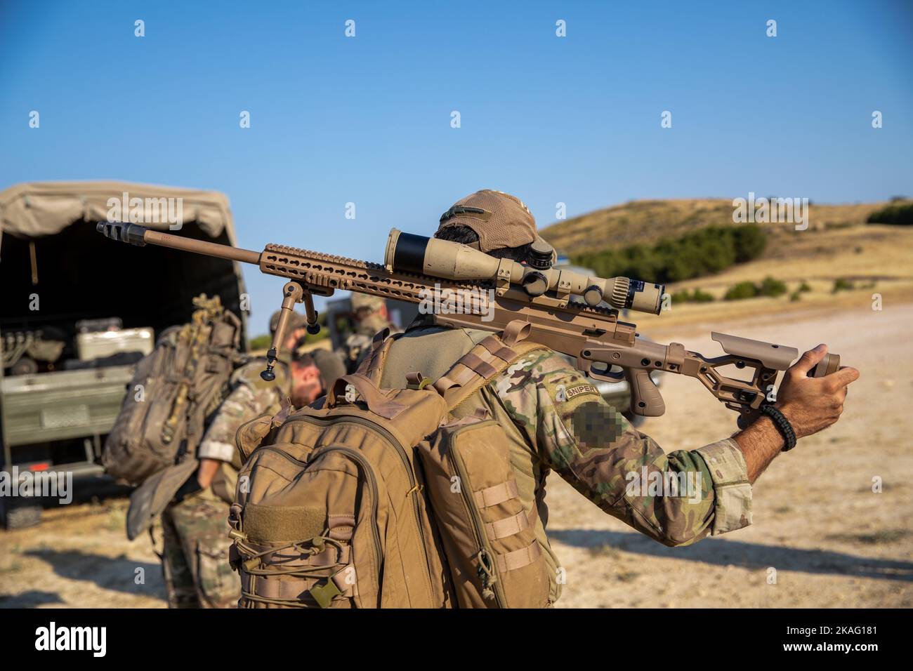 A sniper from the U.S. Army 10th Special Forces Group (Airborne) rests ...