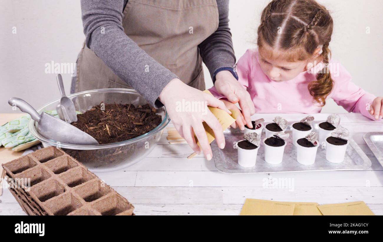 Black girl planting seeds hi-res stock photography and images - Alamy