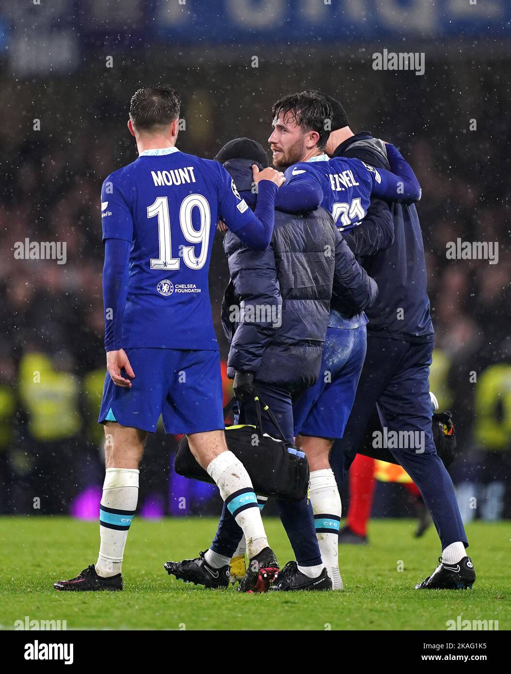 Chelsea's Ben Chilwell (centre) is helped off the field by the medic ...