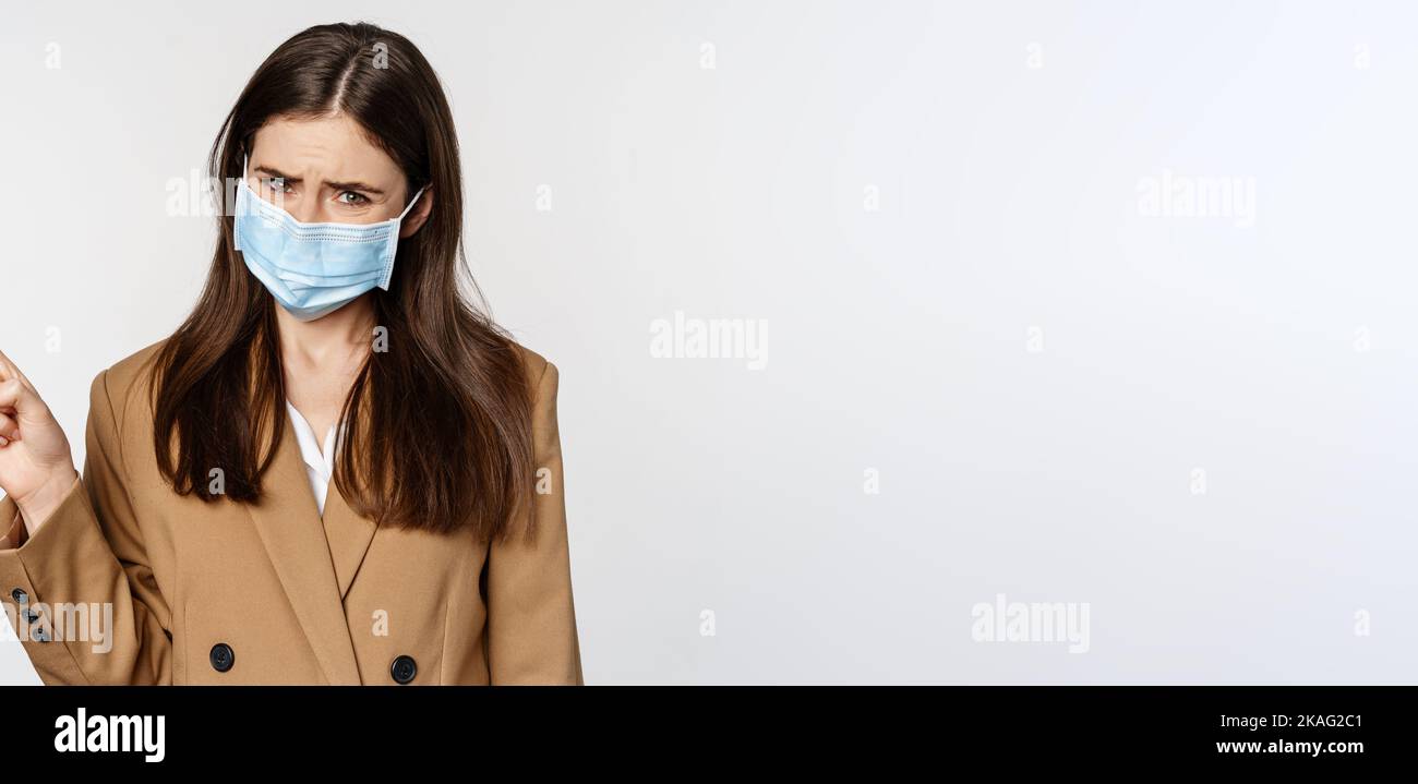 Coronavirus and people concept. Sad and concerned woman in office ...