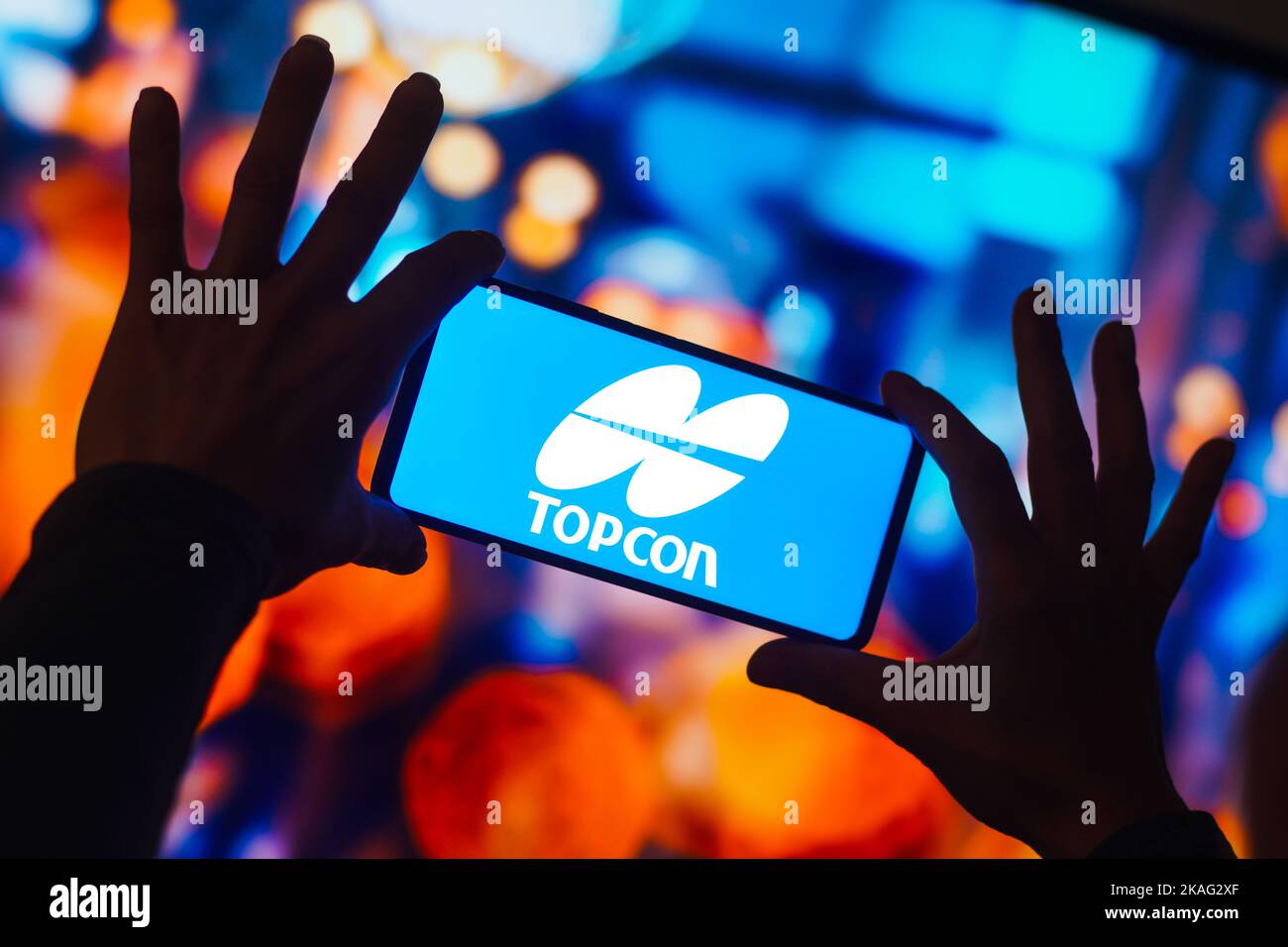 In this photo illustration, the Topcon Corporation logo is displayed on ...