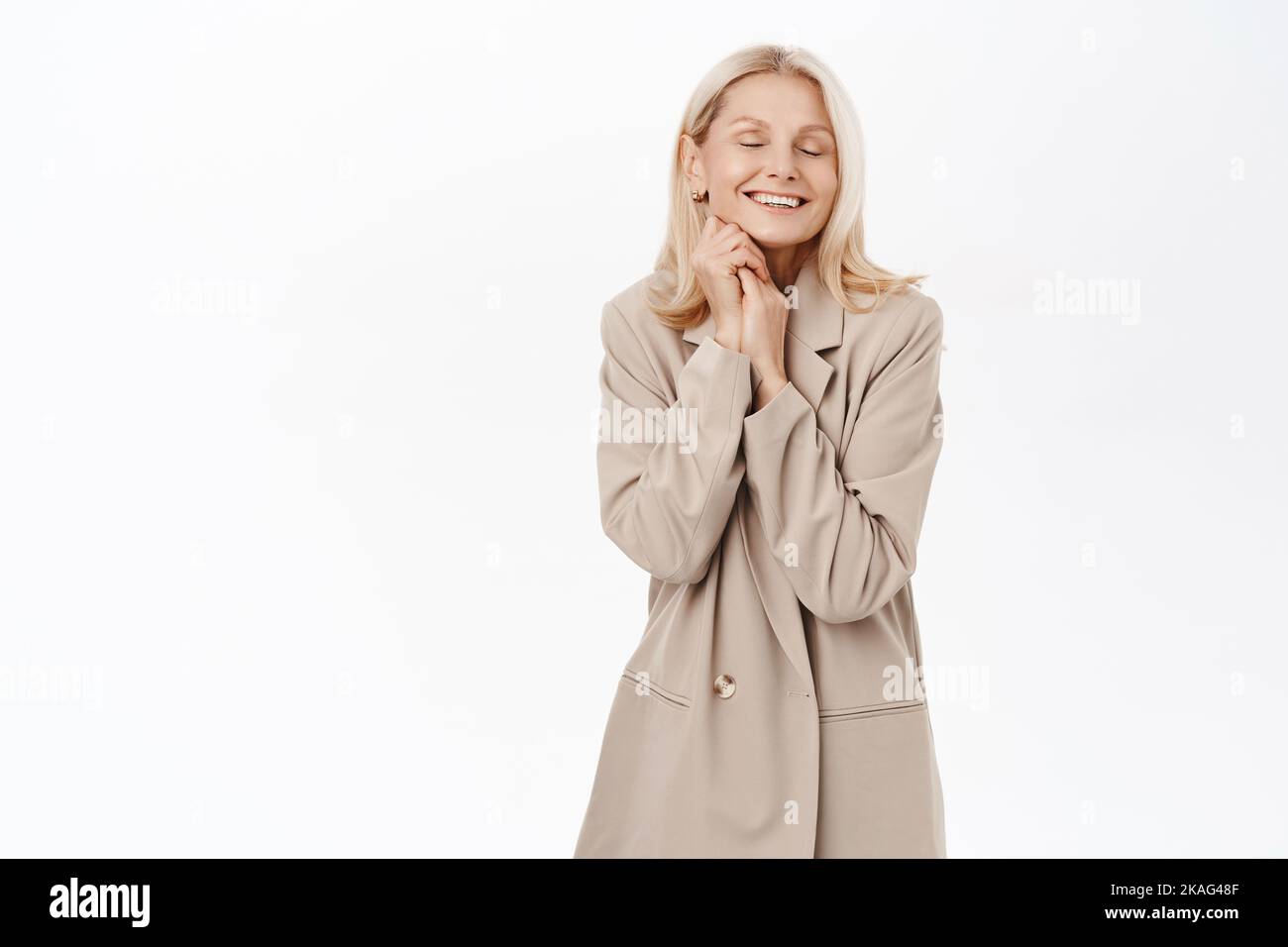 Happy smiling blond middle aged woman, caring older lady thinking ...