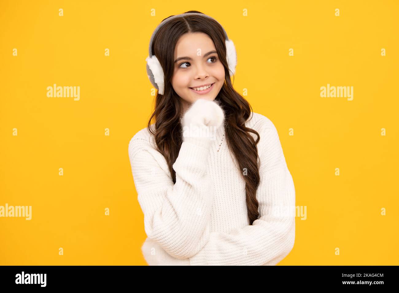 Modern teen girl wearing sweater and winter warm earmuff ear-flaps hat ...