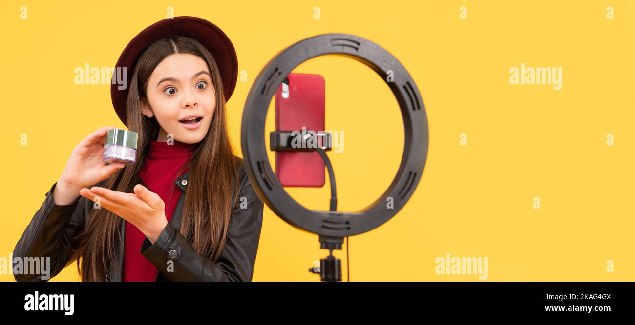 kid beauty blogger. cheerful child do makeup. vlogger with cosmetics ...