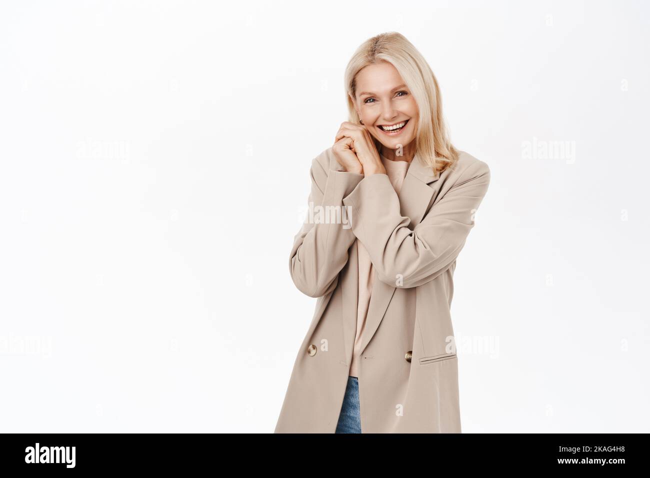 Woman gazing with care and happiness, receive gift, standing flattered ...