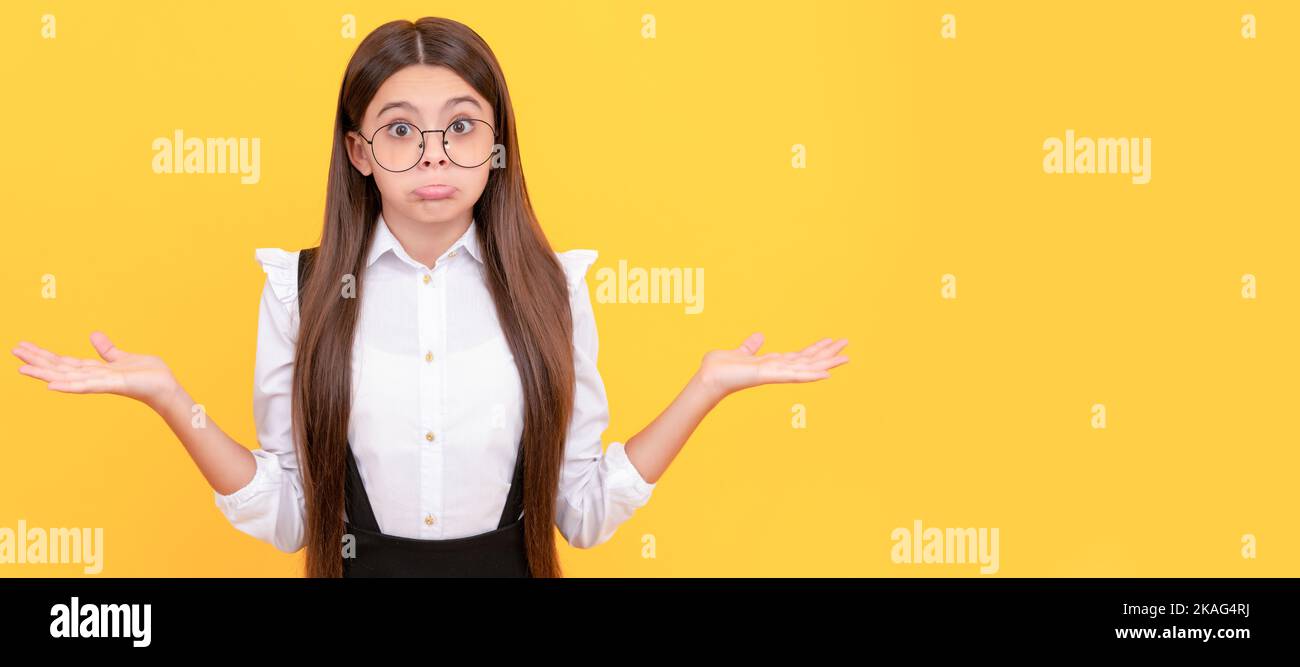 confused child in school uniform and glasses for vision protection ...