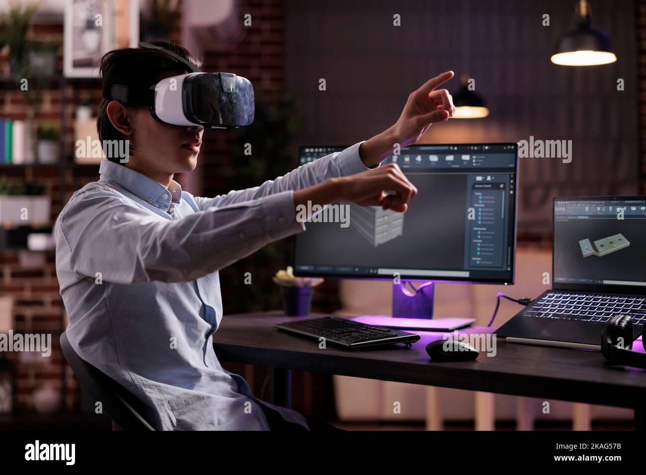 Cad engineer developing industrial product with computer interface and vr glasses. Engineering ...