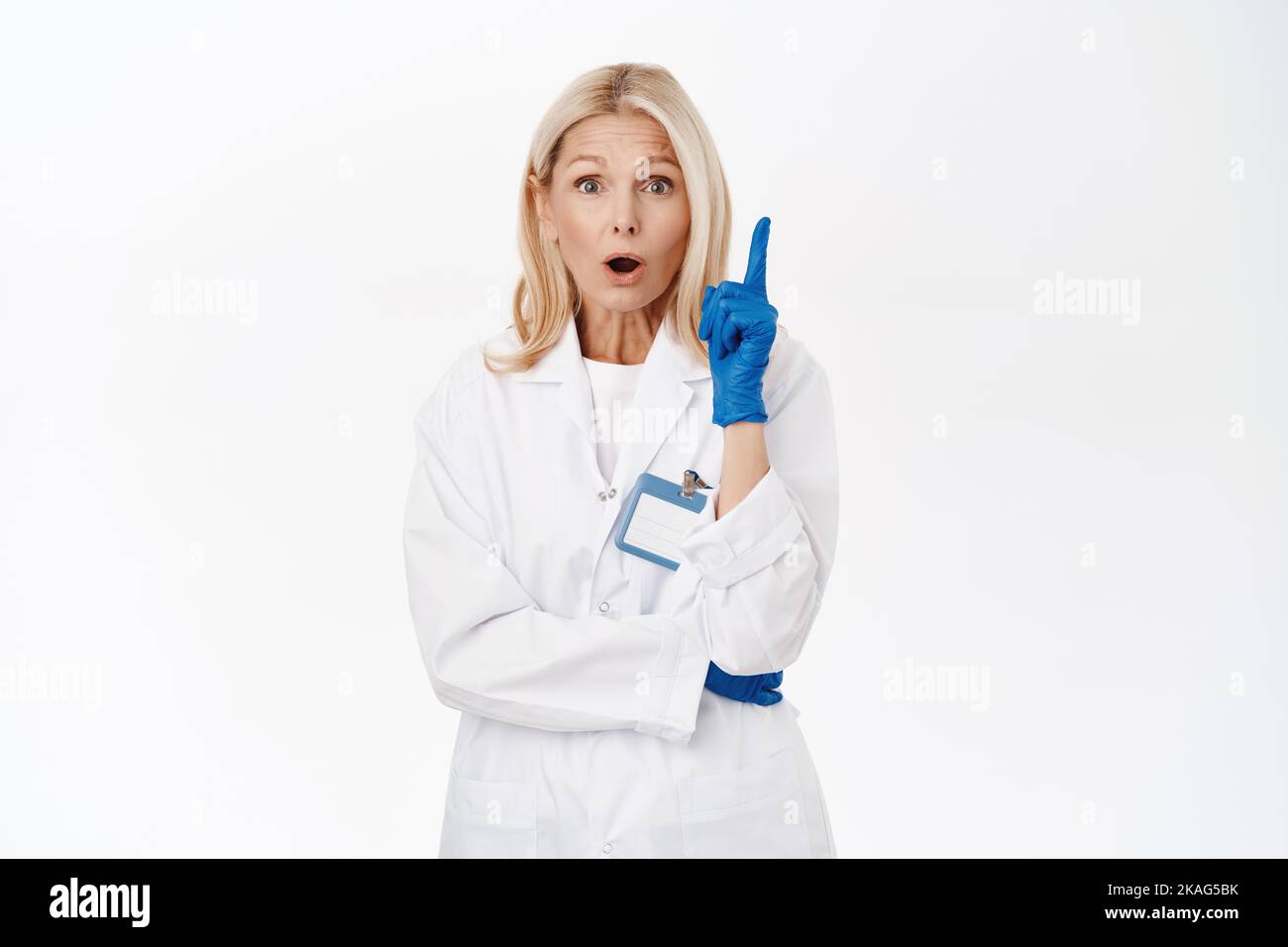 Eureka. Excited female doctor pitching an idea, raising finger to ...