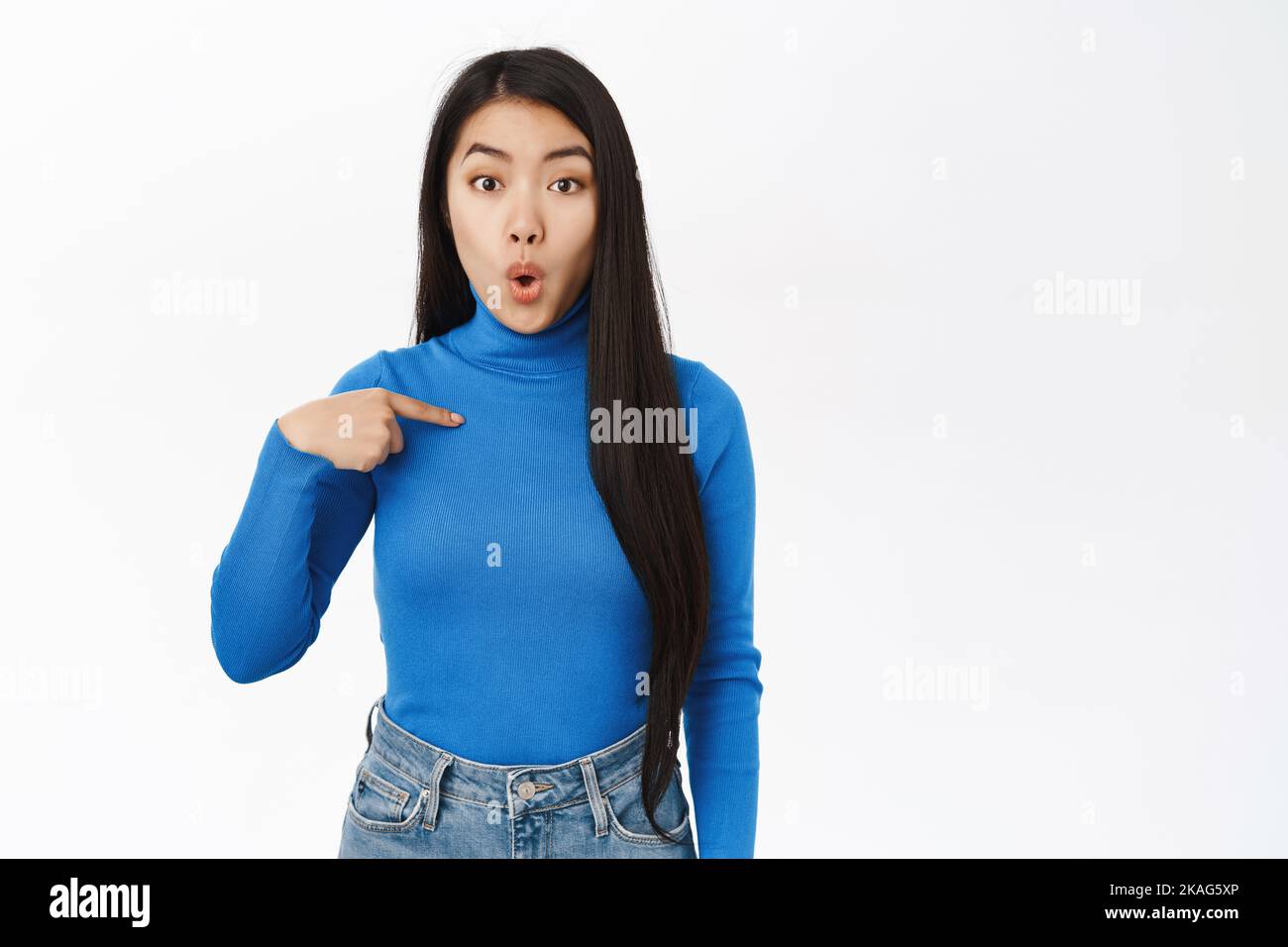 Excited korean woman pointing at herself with surprised, amazed face ...