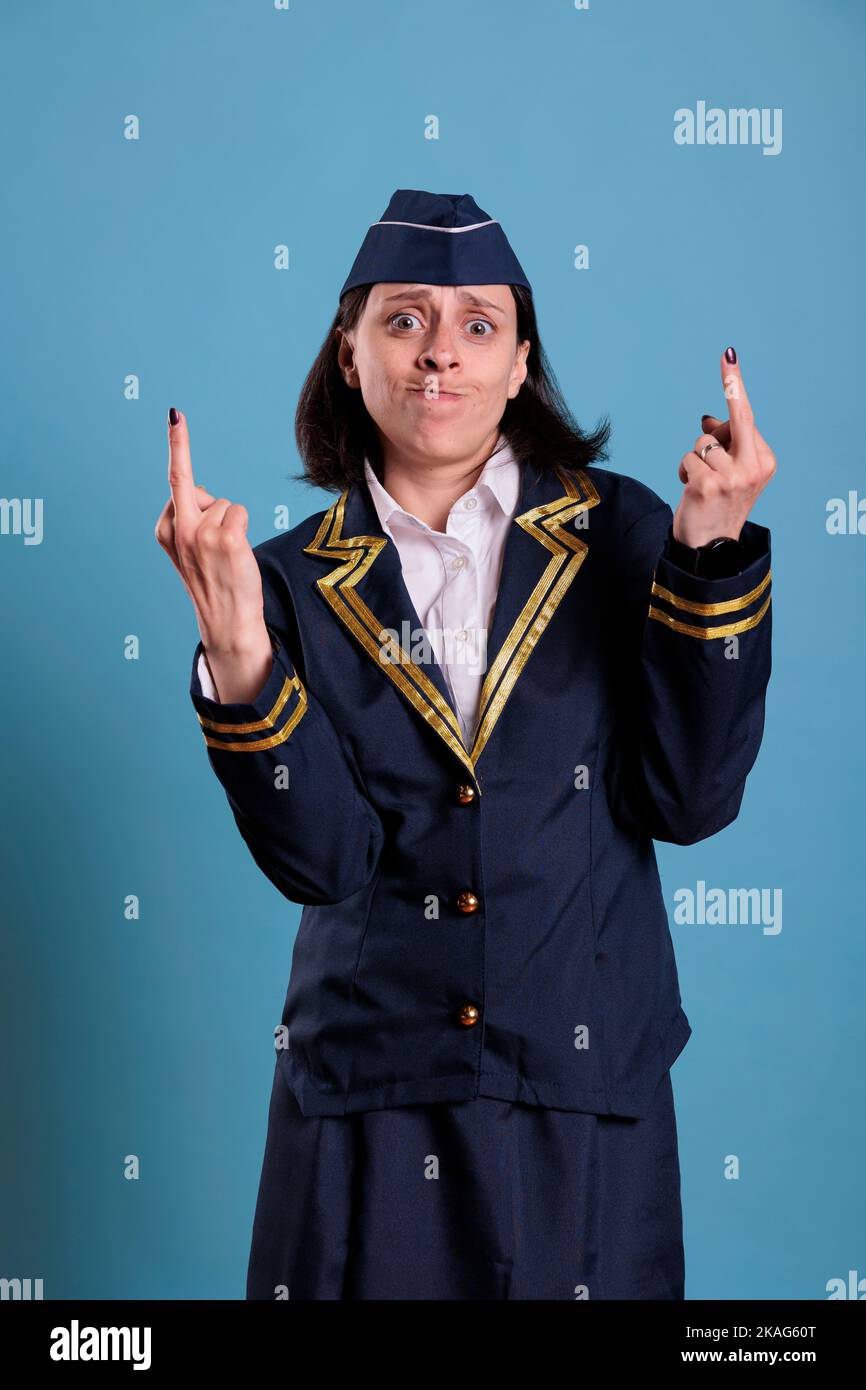 Aggressive Furious Airplane Flight Attendant Showing Middle Finger