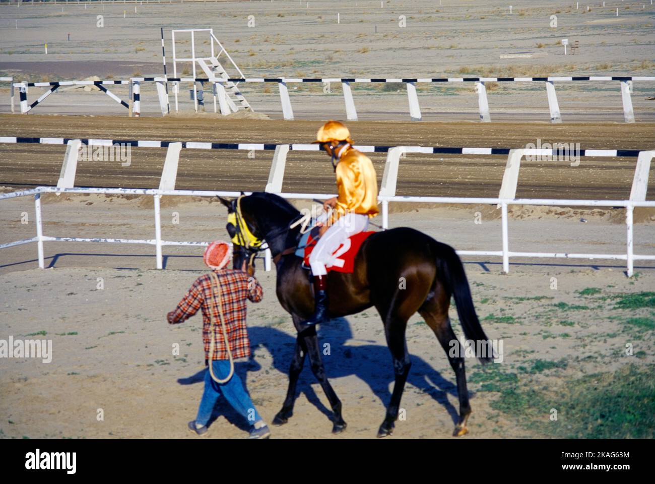 Kuwait Jockey on horse at the Tracks Horse Racing Stock Photo - Alamy