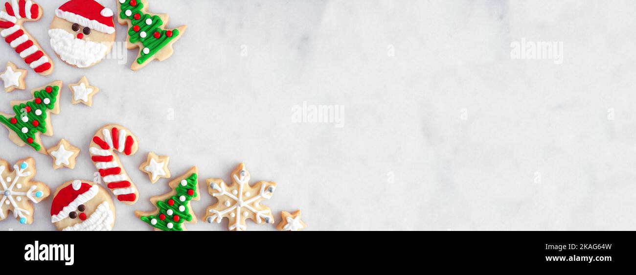 Cute Christmas cookie corner border. Top down view on a white marble ...