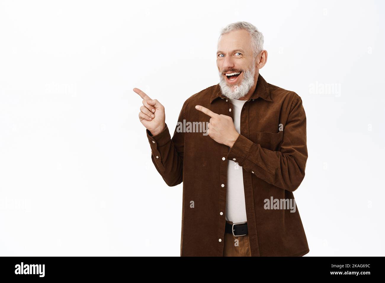 Enthusiastic old man, senior mature person pointing fingers left ...