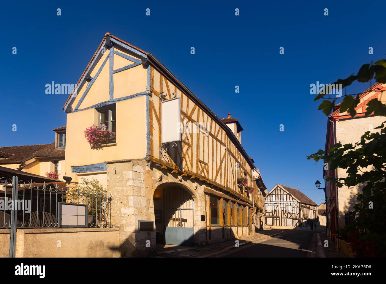 Narrow cobbled street in an old town with half timbered houses hi-res ...