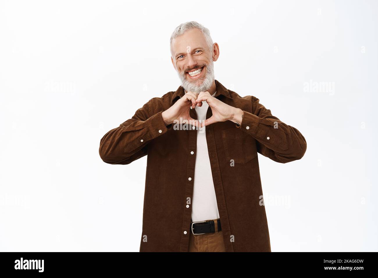 Happy senior man, old husband showing heart love sign and smiling, care ...