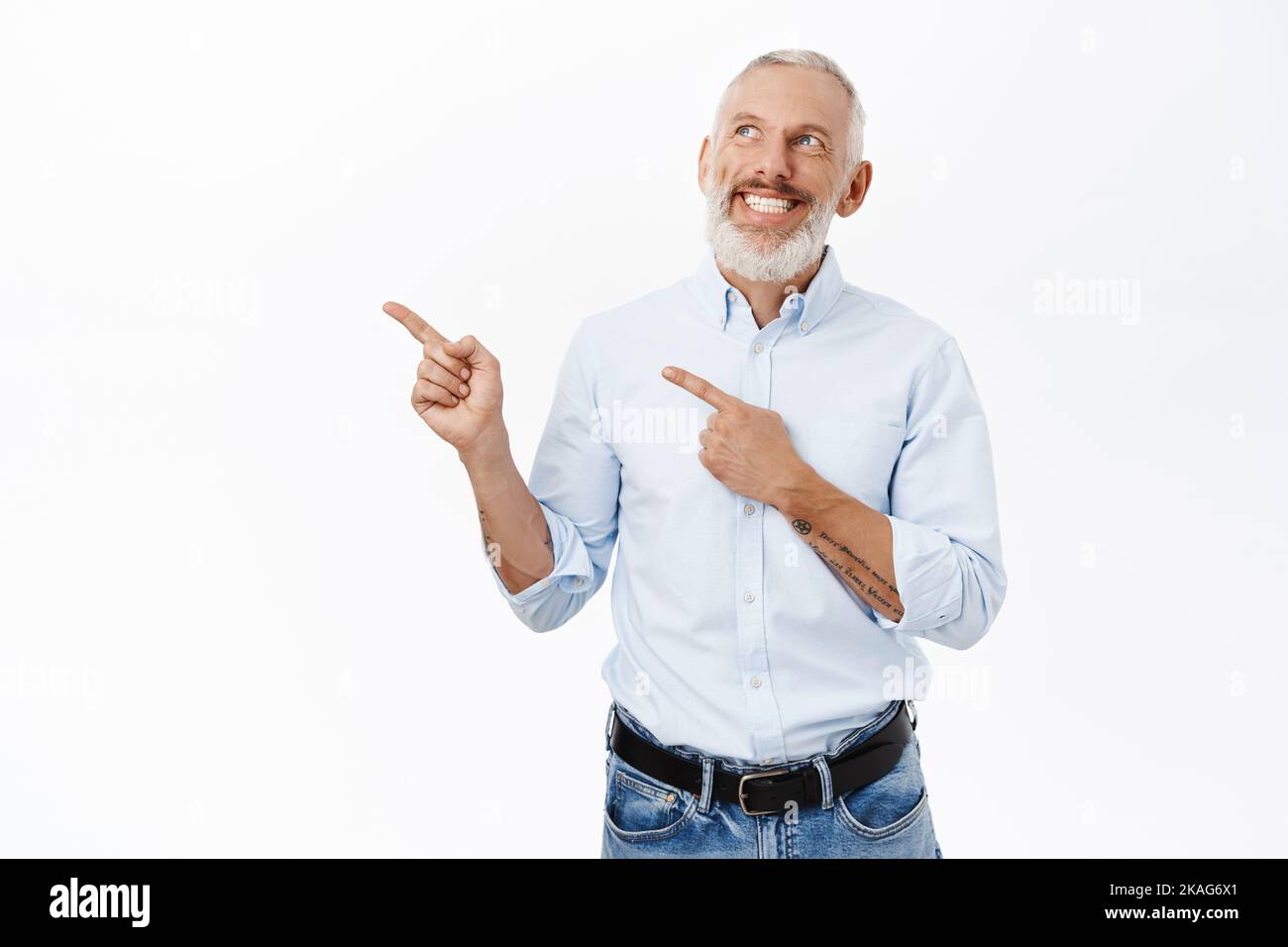 Senior business man pointing fingers left, showing advertisement, promo ...