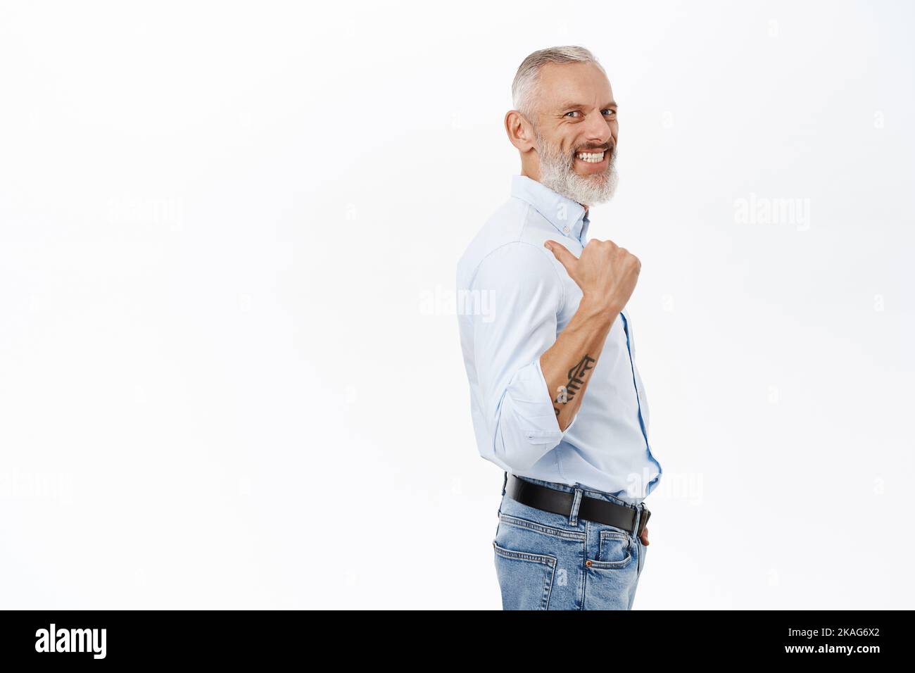 Portrait of handsome mature old man, pointing finger left, behind ...