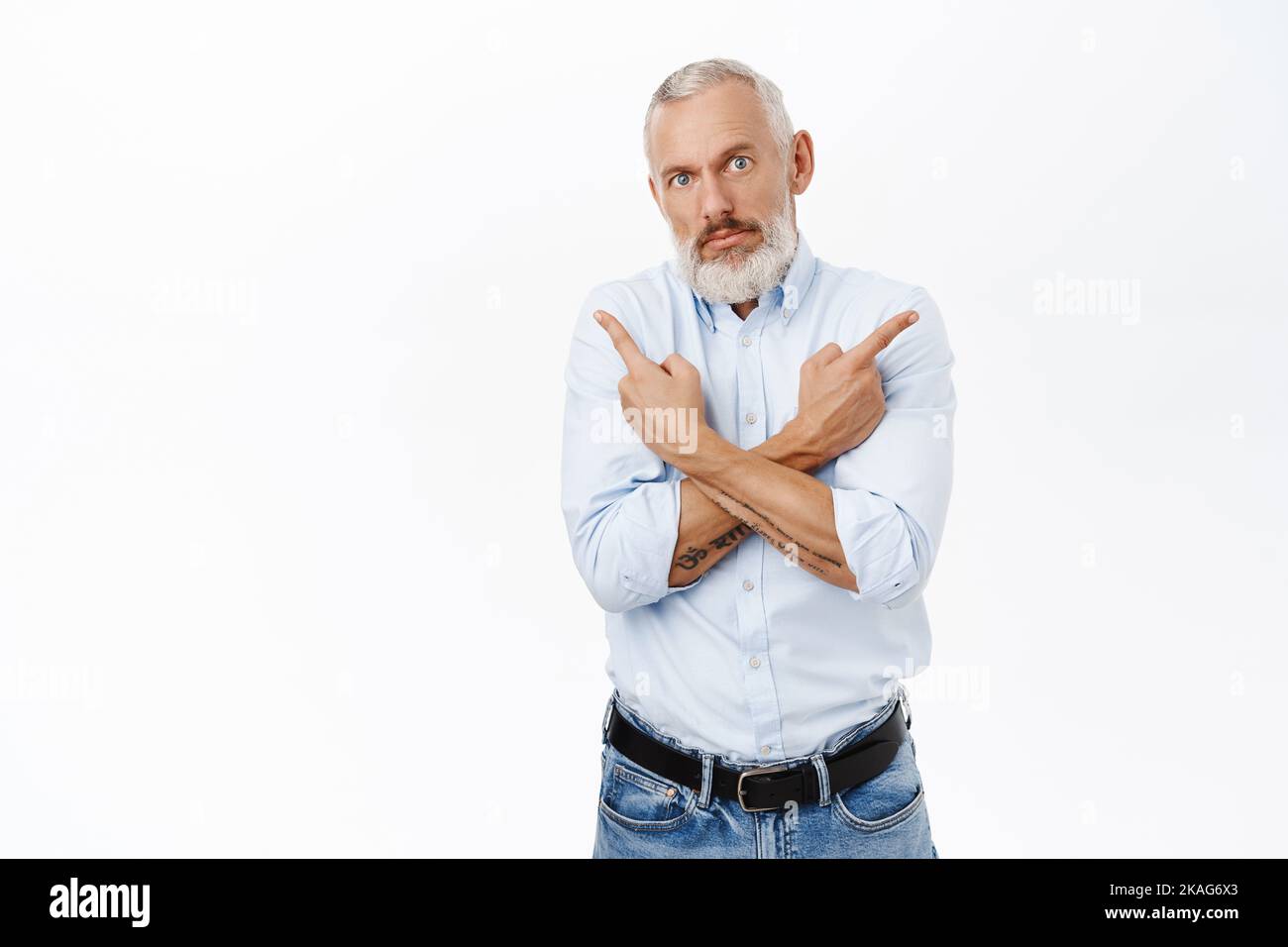 Confused businessman pointing sideways, looking clueless, puzzled to ...