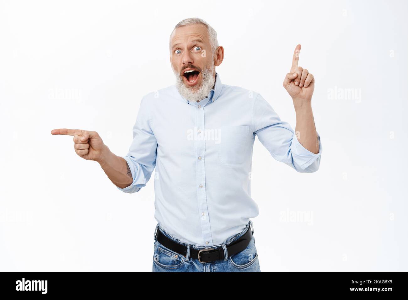 Portrait of senior business man pointing up and left, showing two ...