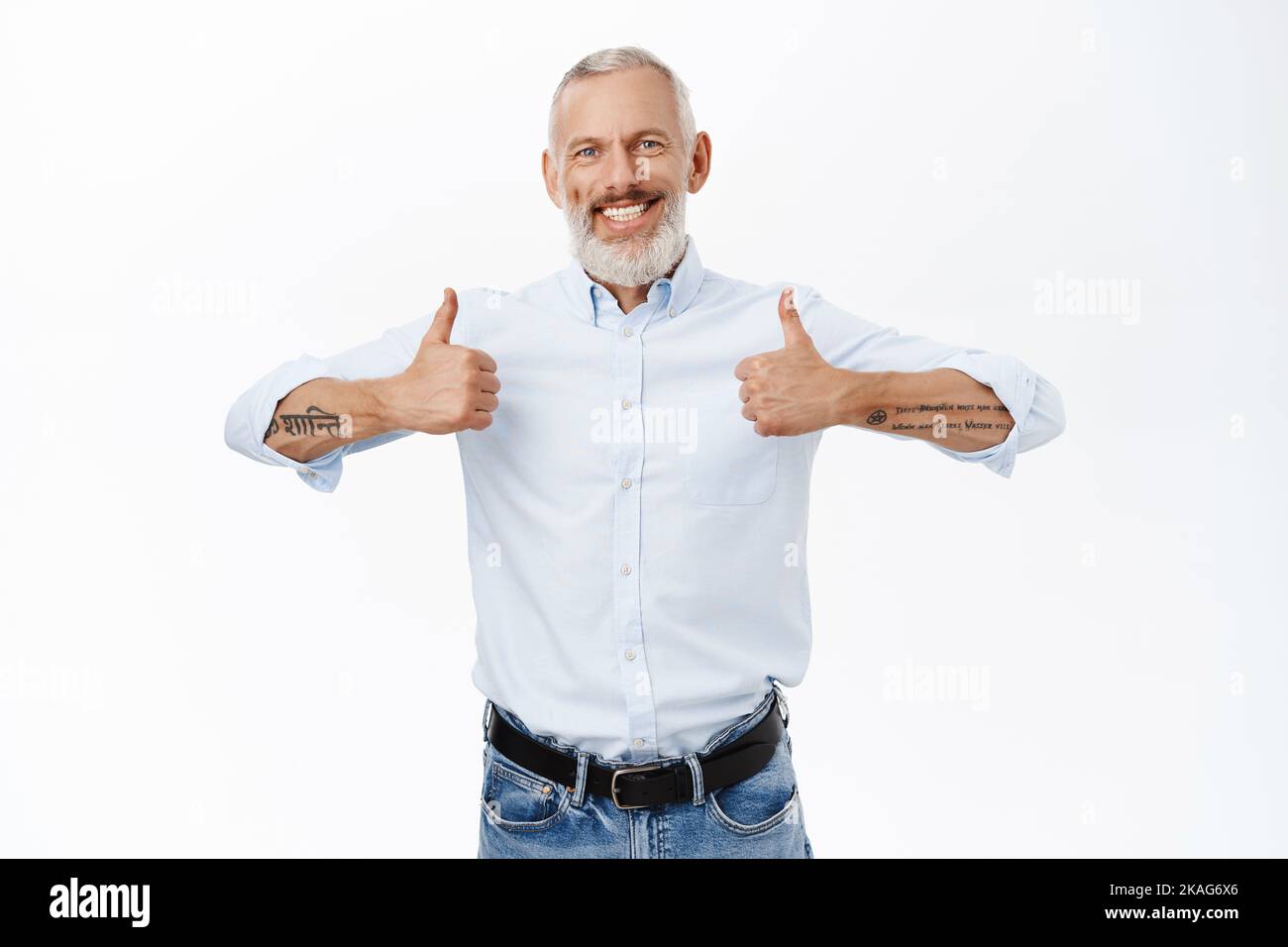 Smiling mature guy, businessman showing thumbs up in approval ...