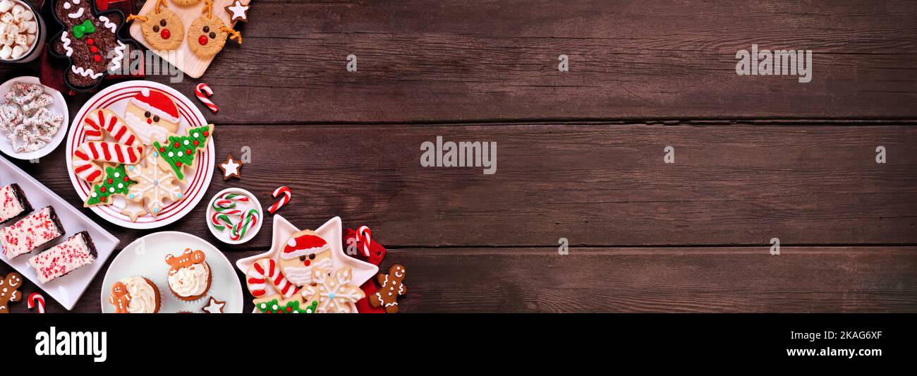 Cute Christmas sweets and cookie corner border. Above view on a rustic ...