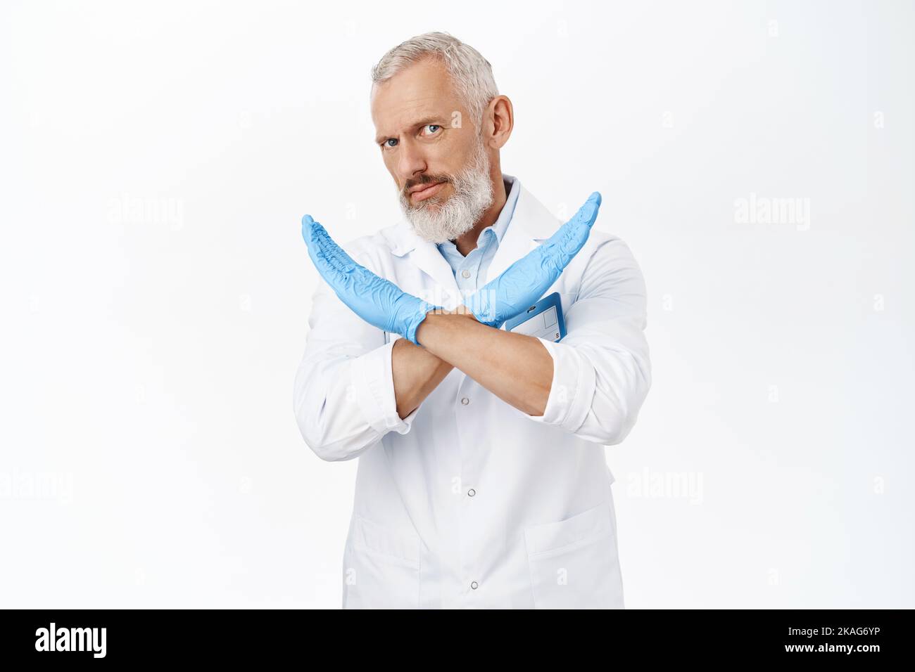 Image of senior doctor, male physician showing stop sign, prohibition ...